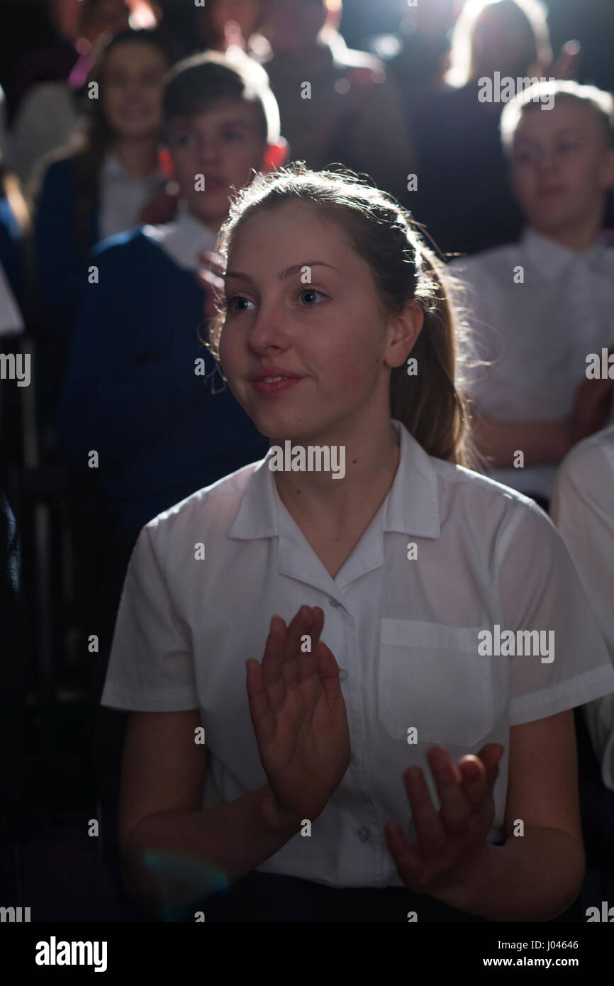 Clapping crowd smiling looking away hi-res stock photography and images ...