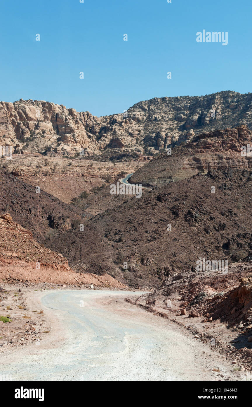 The mountain and desertic landscape seen from the road that links the ...