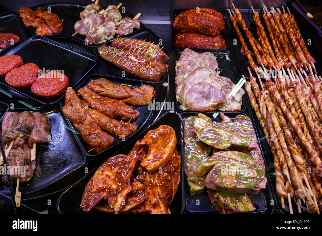 Marinaded meat for grilling in a counter display in a supermarket. meat ...