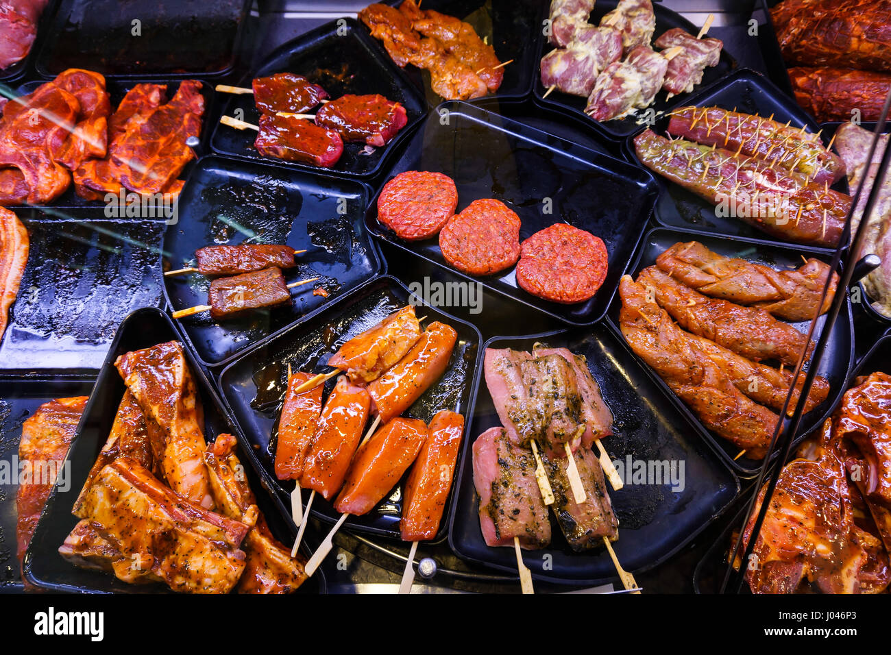 Marinaded meat for grilling in a counter display in a supermarket. meat ...