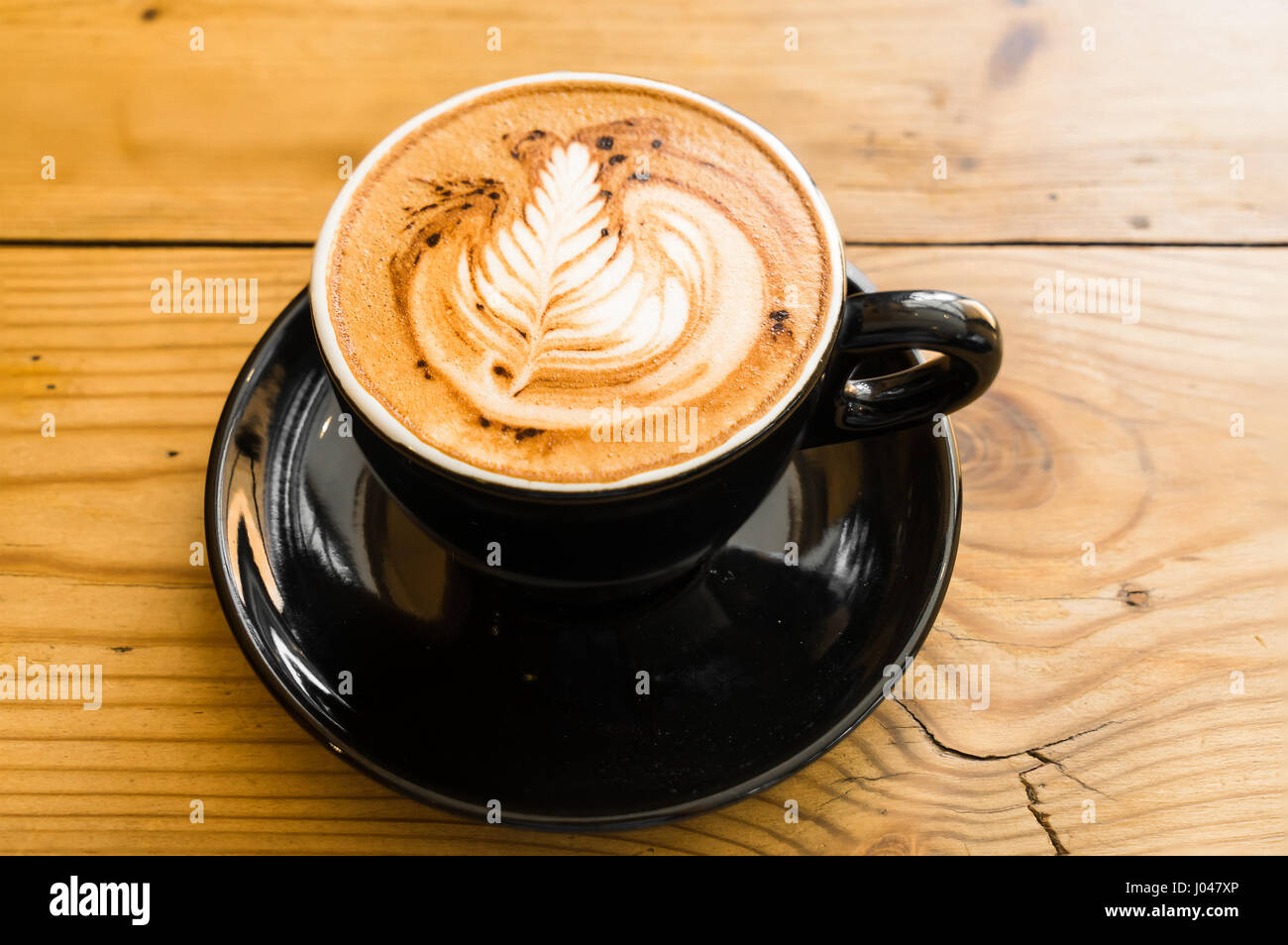 Hot Coffee Mocha on the brown wooden table with chocolate. Top view ...