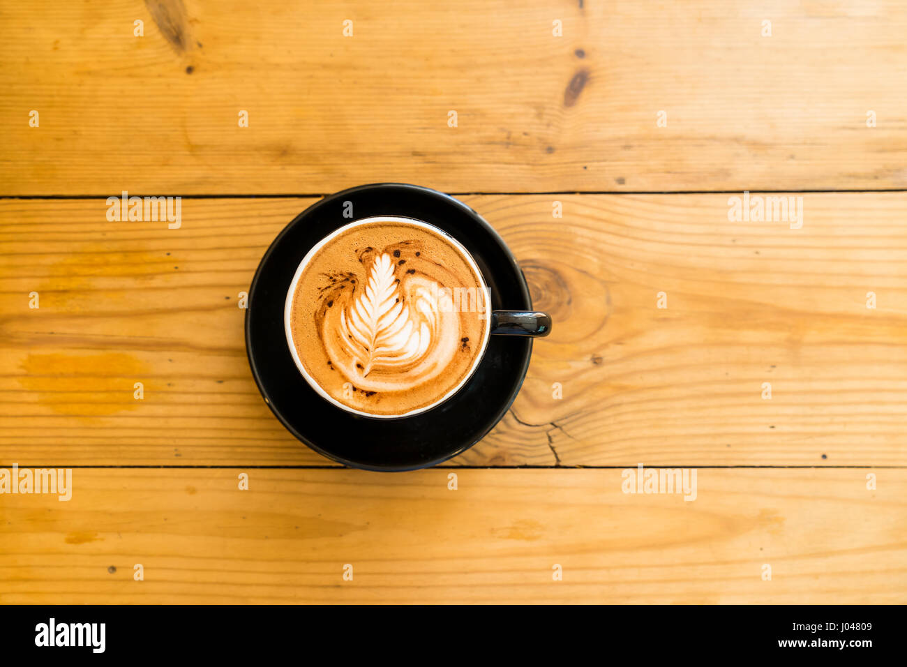 Hot Coffee Mocha on the brown wooden table with chocolate. Top view ...