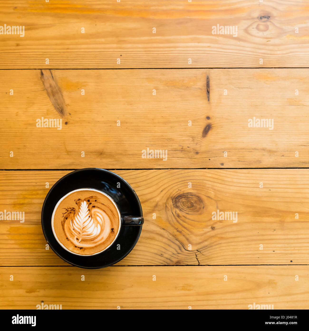 Hot Coffee Mocha on the brown wooden table with chocolate. Top view ...