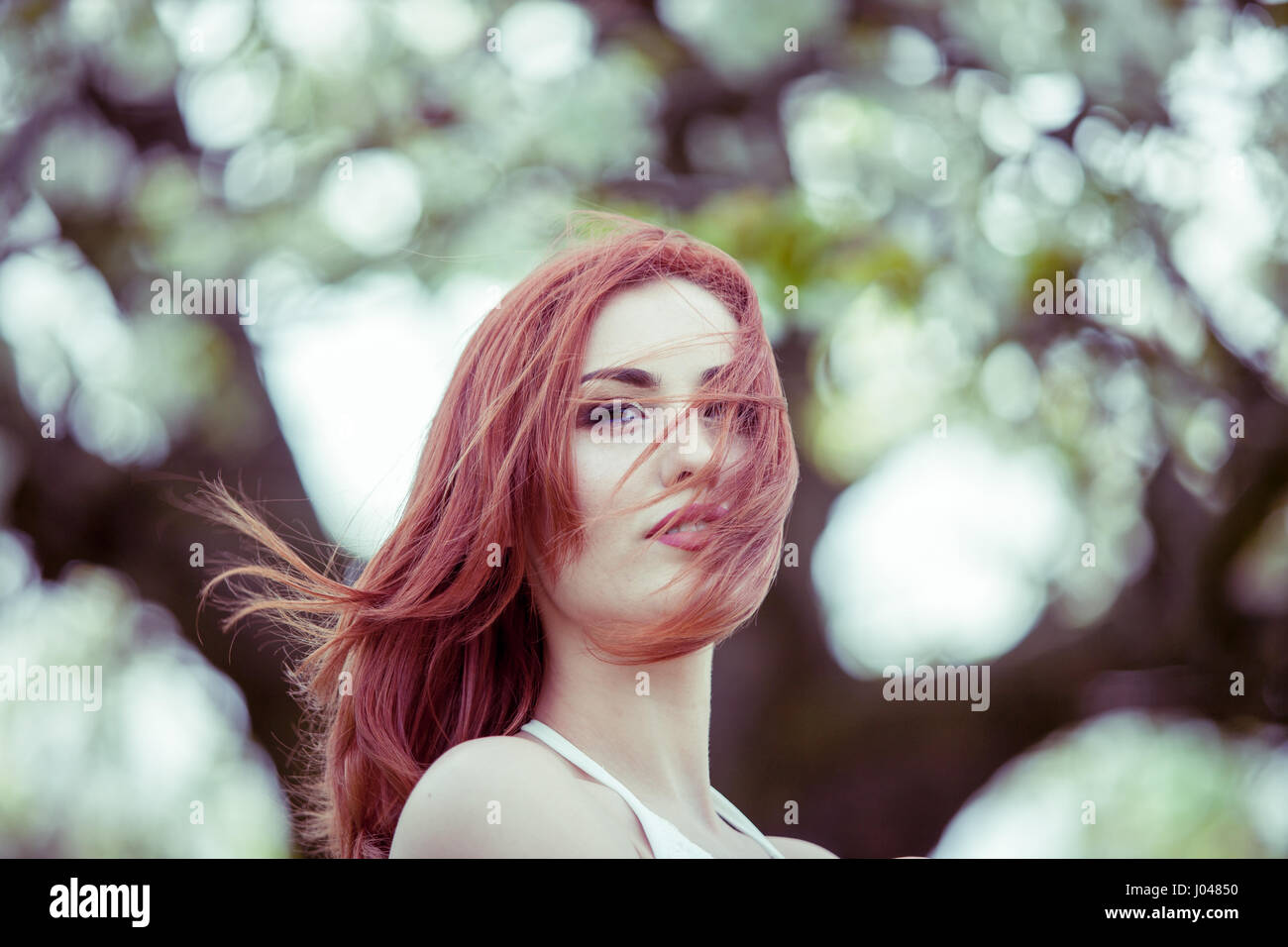 Gorgeous woman with hair in wind Stock Photo - Alamy