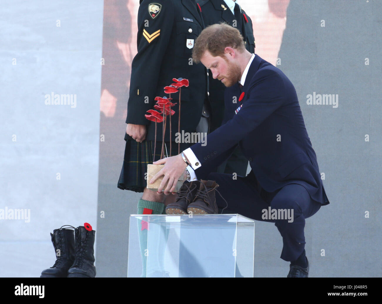 Prince Harry lays boots and poppies in remembrance at Vimy Memorial ...