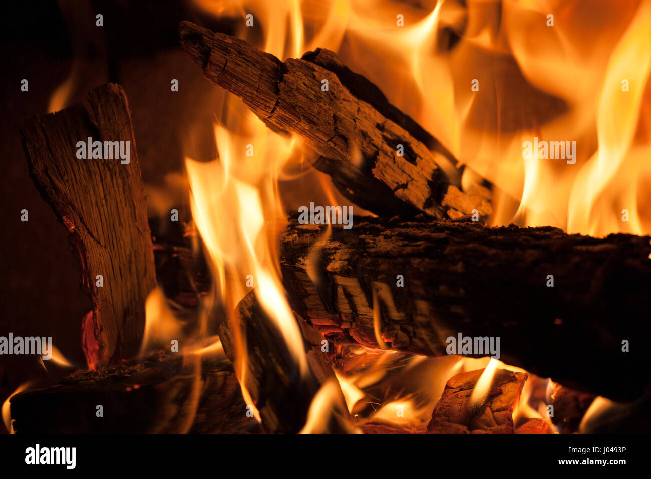 Fireplace. Burning fire at the fireplace Stock Photo - Alamy