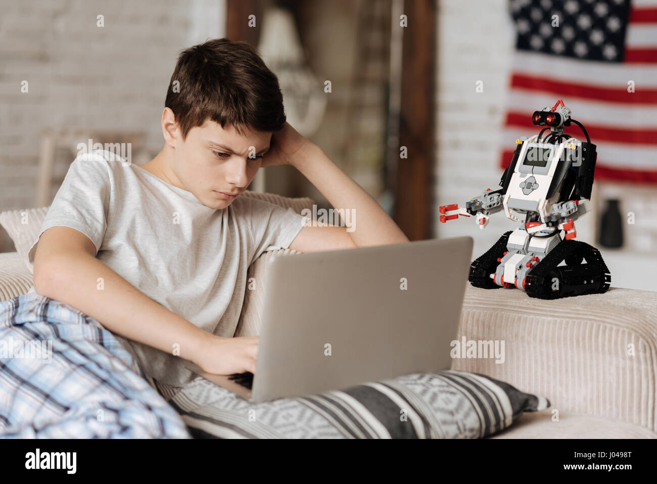 Angry teenager looking at computer Stock Photo - Alamy