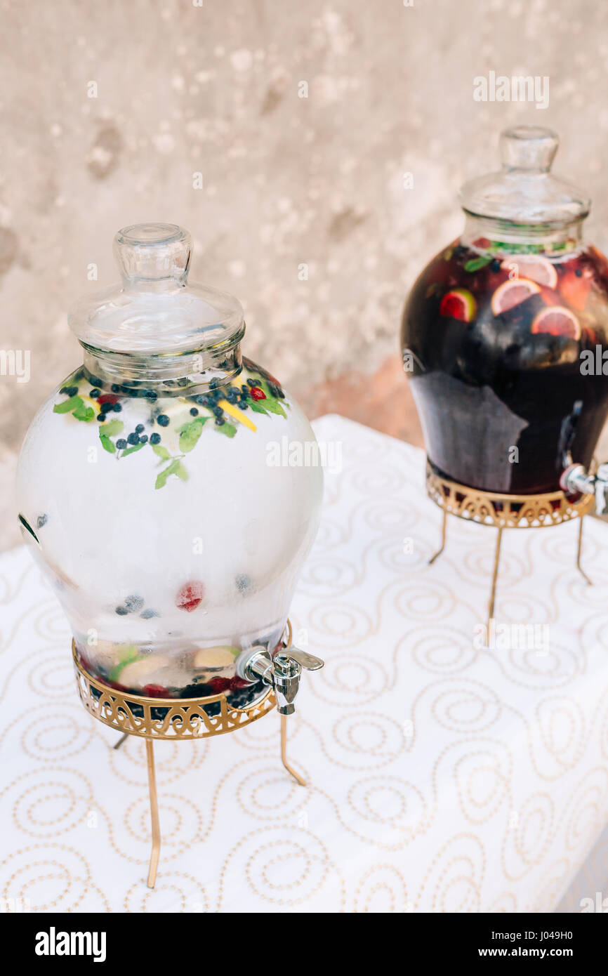 Lemonade in a glass barrel. Flasks for spilling drinks. Lemonade Stock ...