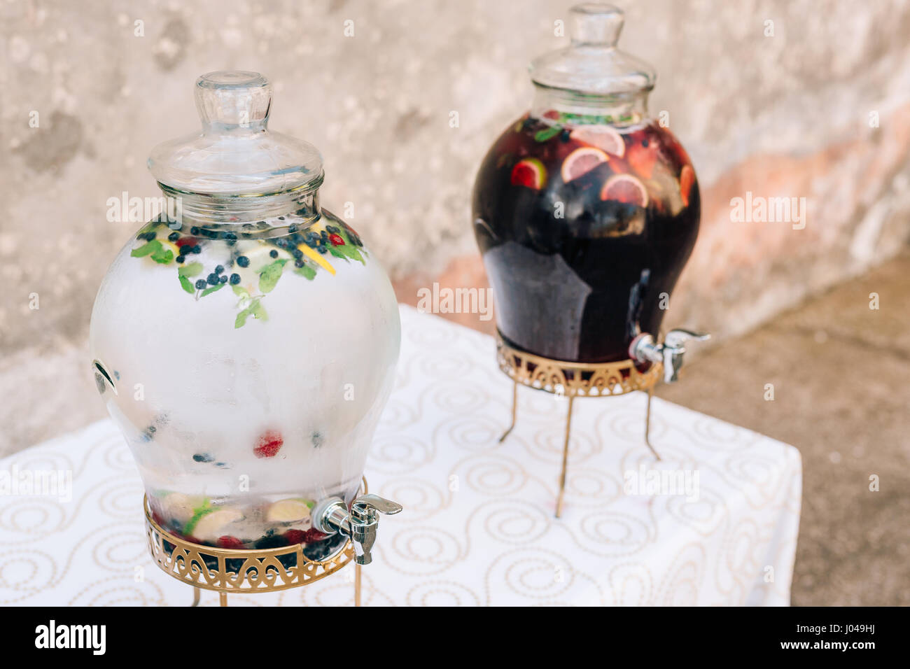 Lemonade in a glass barrel. Flasks for spilling drinks. Lemonade Stock ...