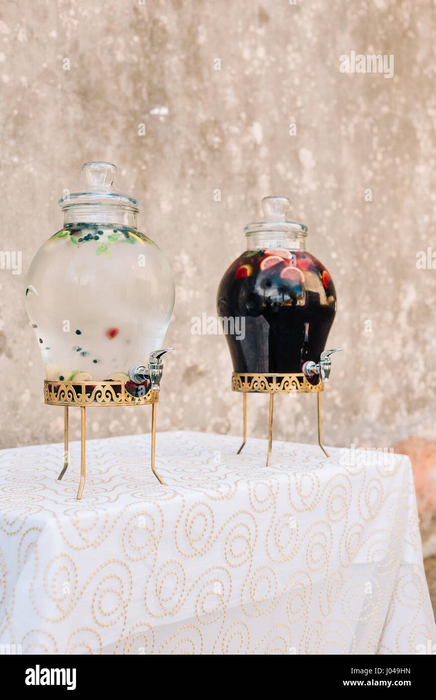 Lemonade in a glass barrel. Flasks for spilling drinks. Lemonade Stock ...