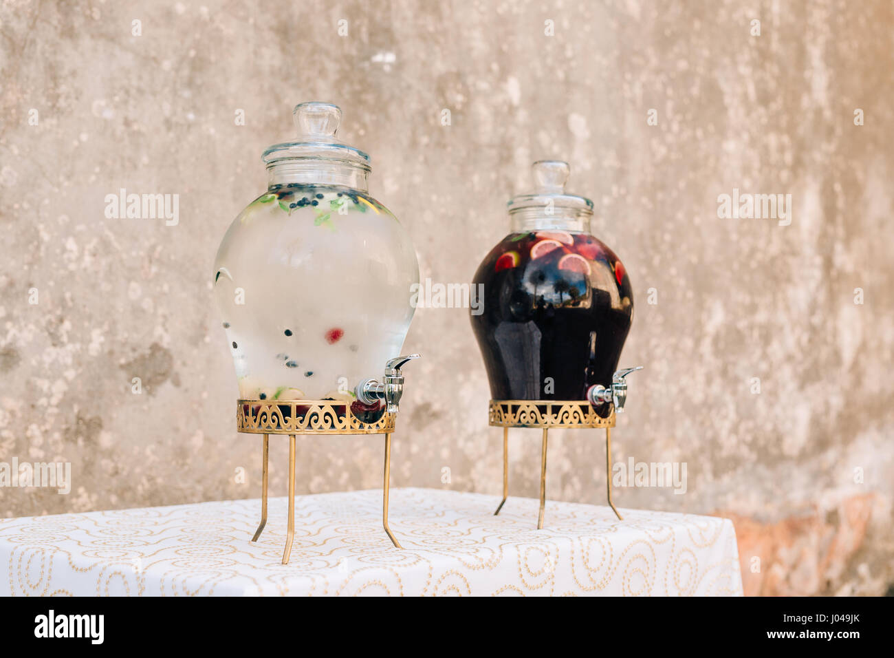 Lemonade in a glass barrel. Flasks for spilling drinks. Lemonade Stock ...