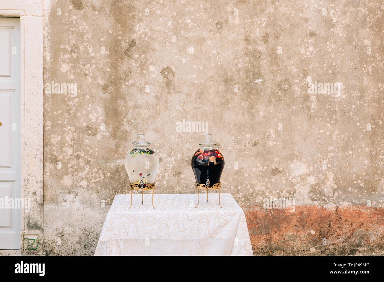 Lemonade in a glass barrel. Flasks for spilling drinks. Lemonade Stock ...