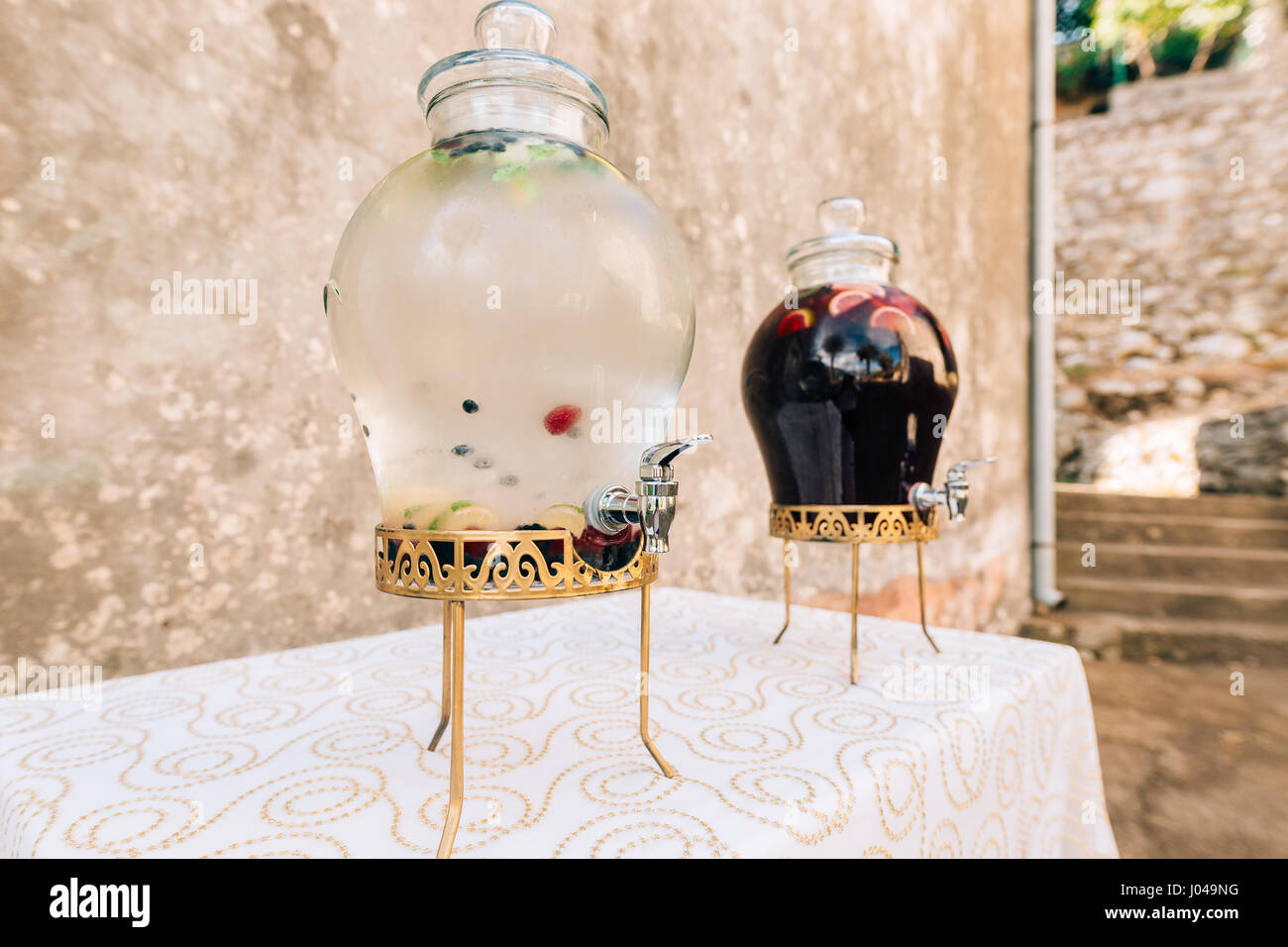 Lemonade in a glass barrel. Flasks for spilling drinks. Lemonade Stock ...