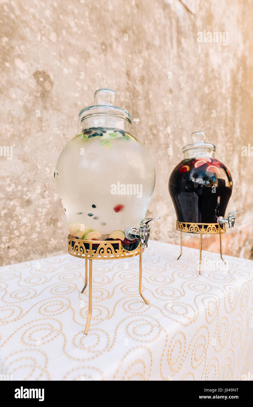 Lemonade in a glass barrel. Flasks for spilling drinks. Lemonade Stock ...