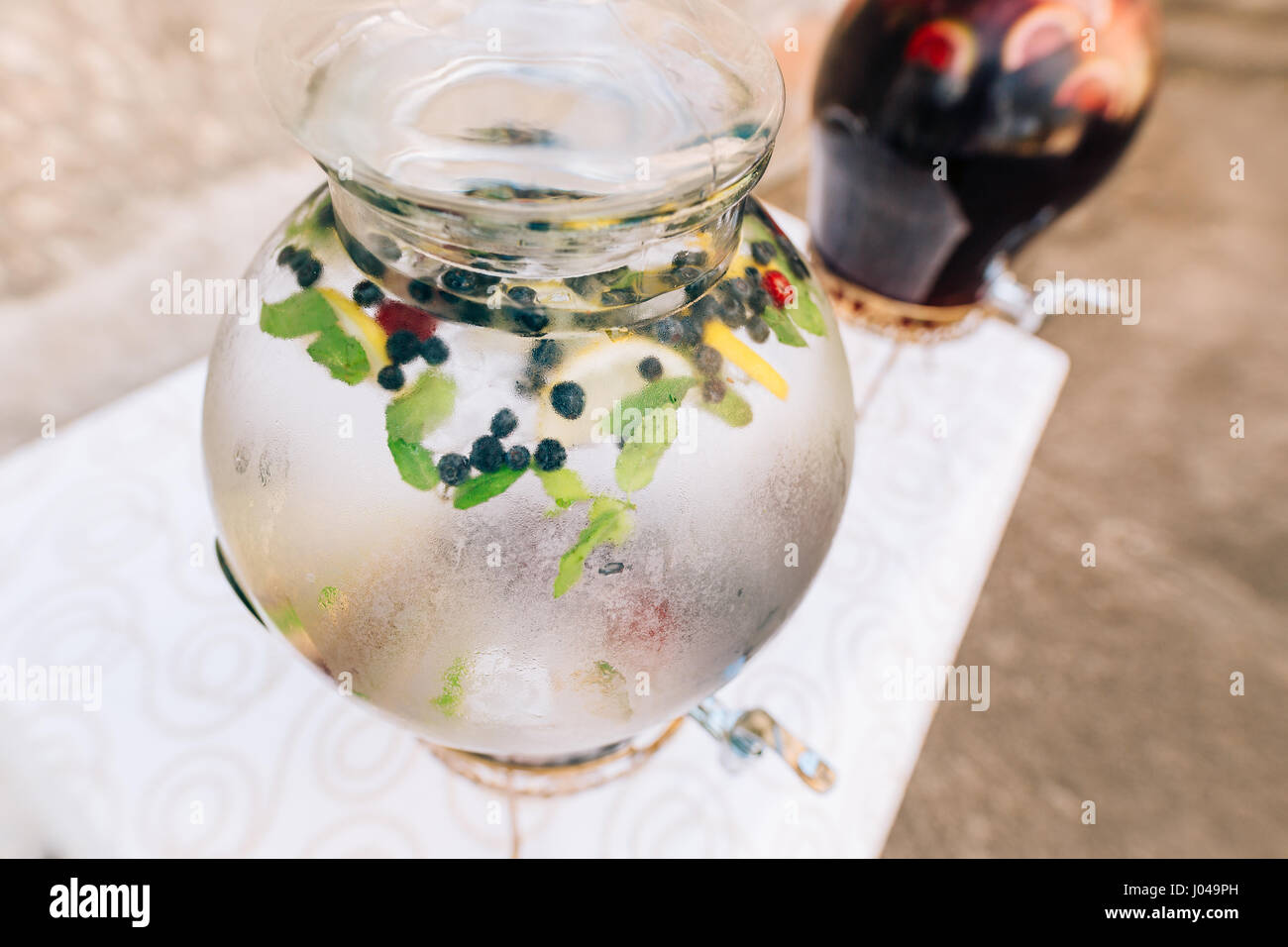 Lemonade in a glass barrel. Flasks for spilling drinks. Lemonade Stock ...