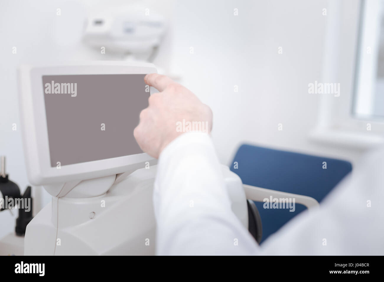 Close up of a doctors hand pointing at the screen Stock Photo - Alamy