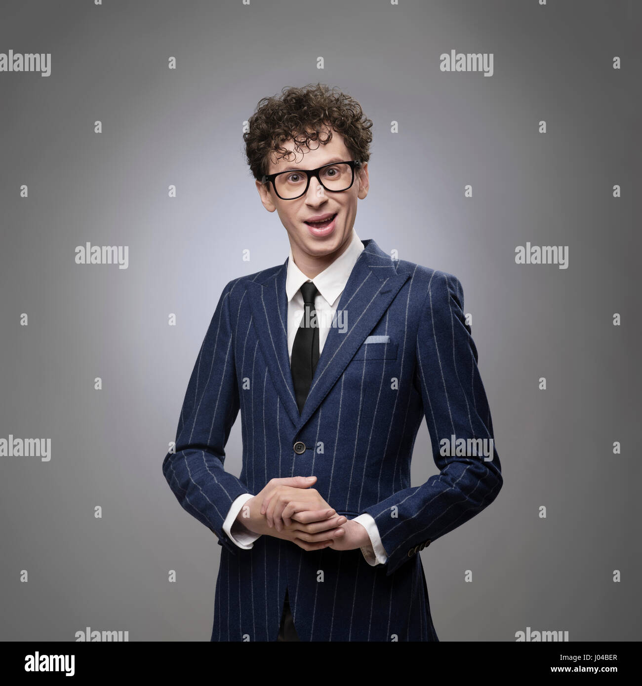 Funny shocked man in striped suit. Professional actor facial expression ...