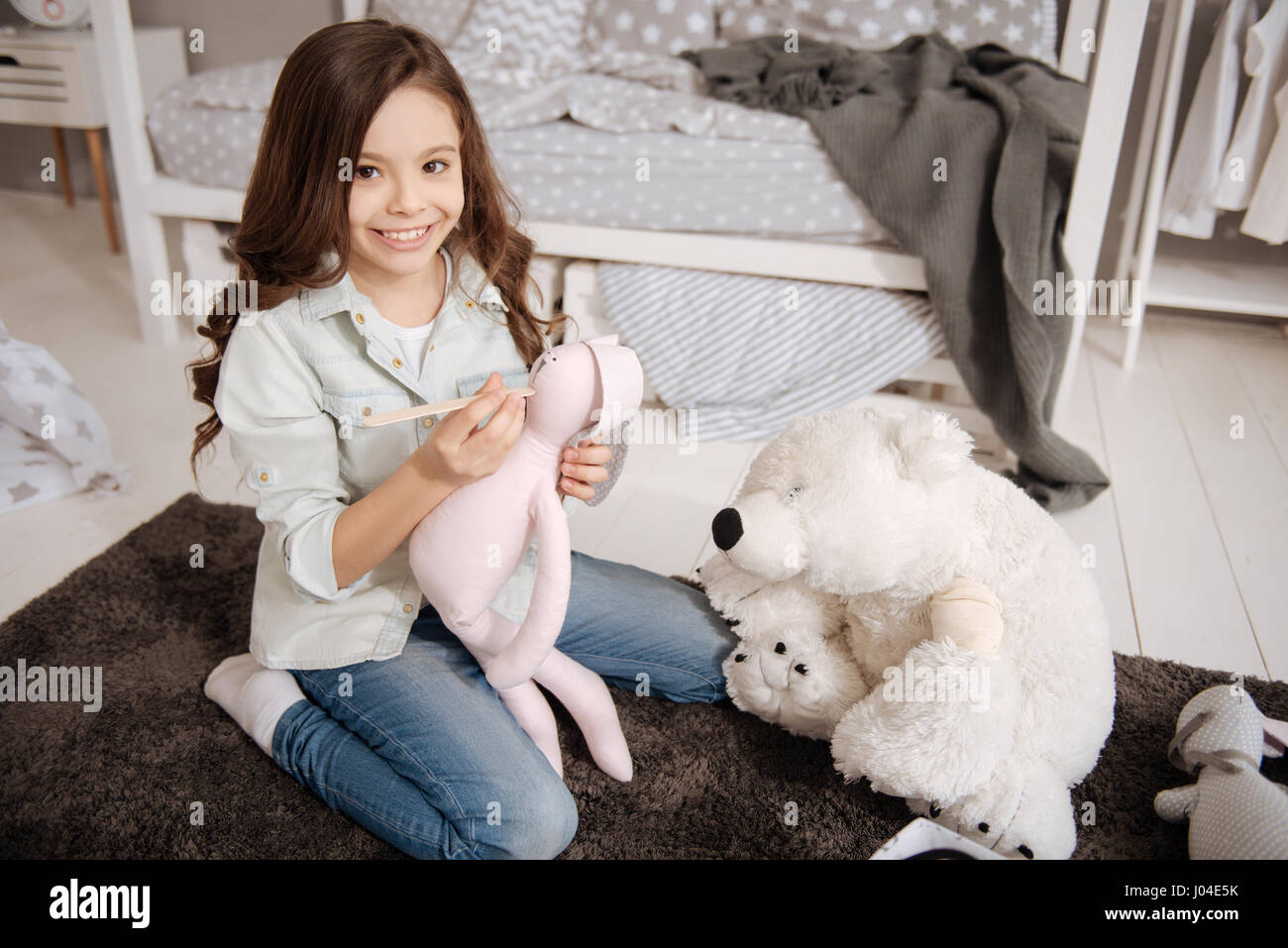 Caring kid playing with toys at home Stock Photo - Alamy