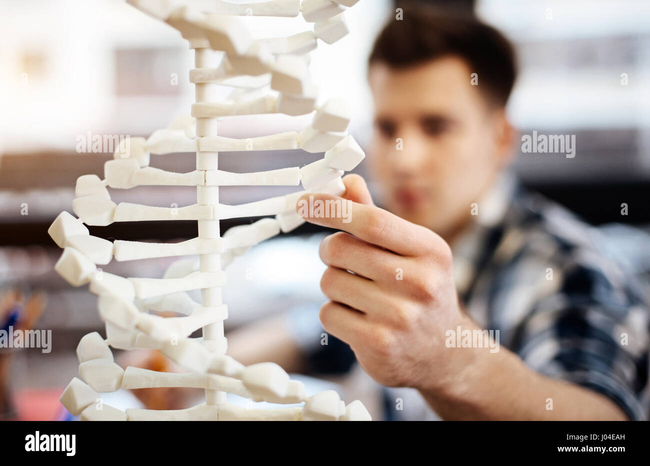 Diligent student learnign DNA model Stock Photo - Alamy