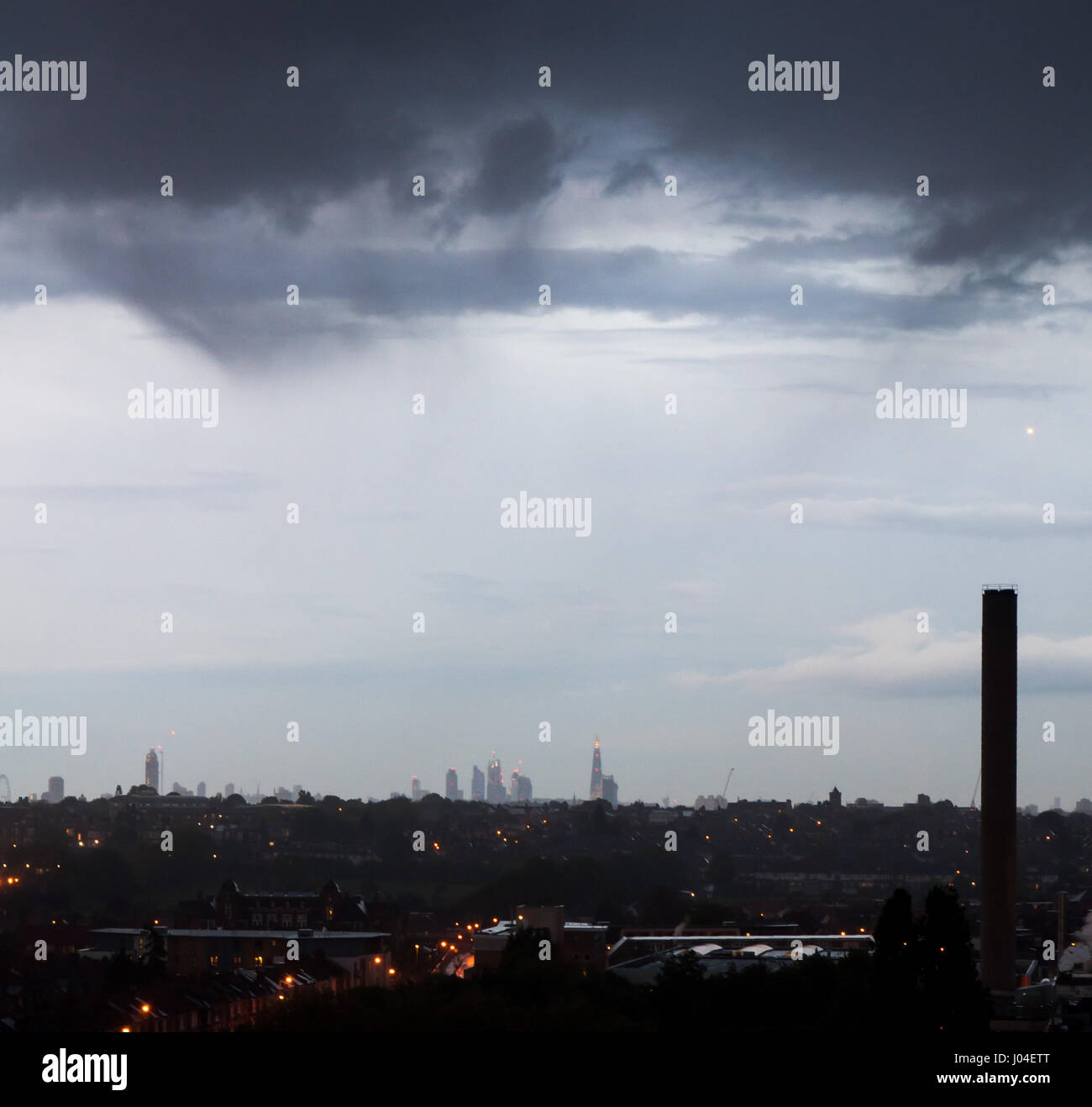 The distant City of London skyline seen from the south London suburb of ...