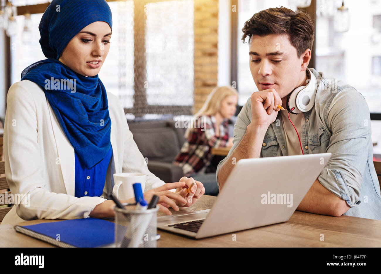 Involved international students studying together Stock Photo - Alamy