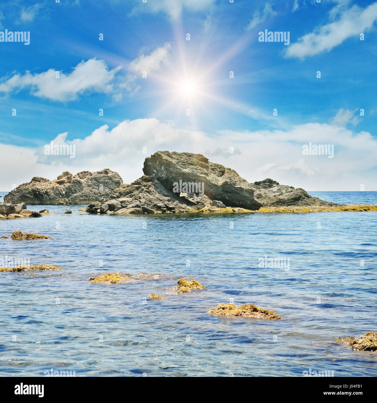 ocean, picturesque beach and blue sky Stock Photo - Alamy