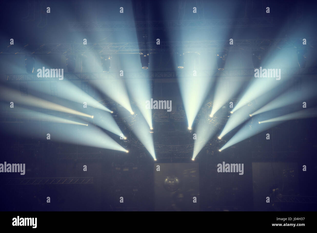 stage before the concert shines the beams of searchlights Stock Photo ...