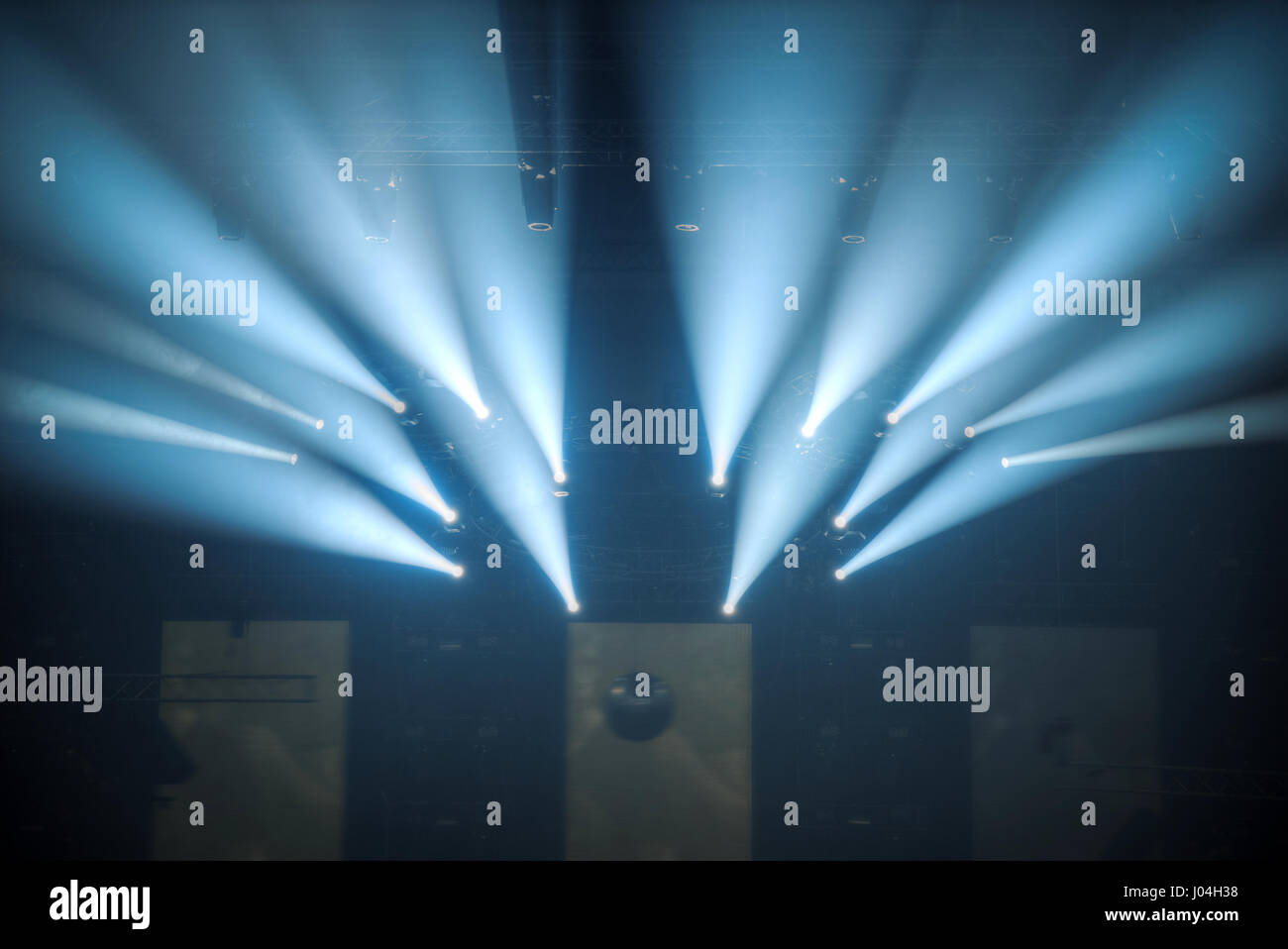 stage before the concert shines the beams of searchlights Stock Photo ...