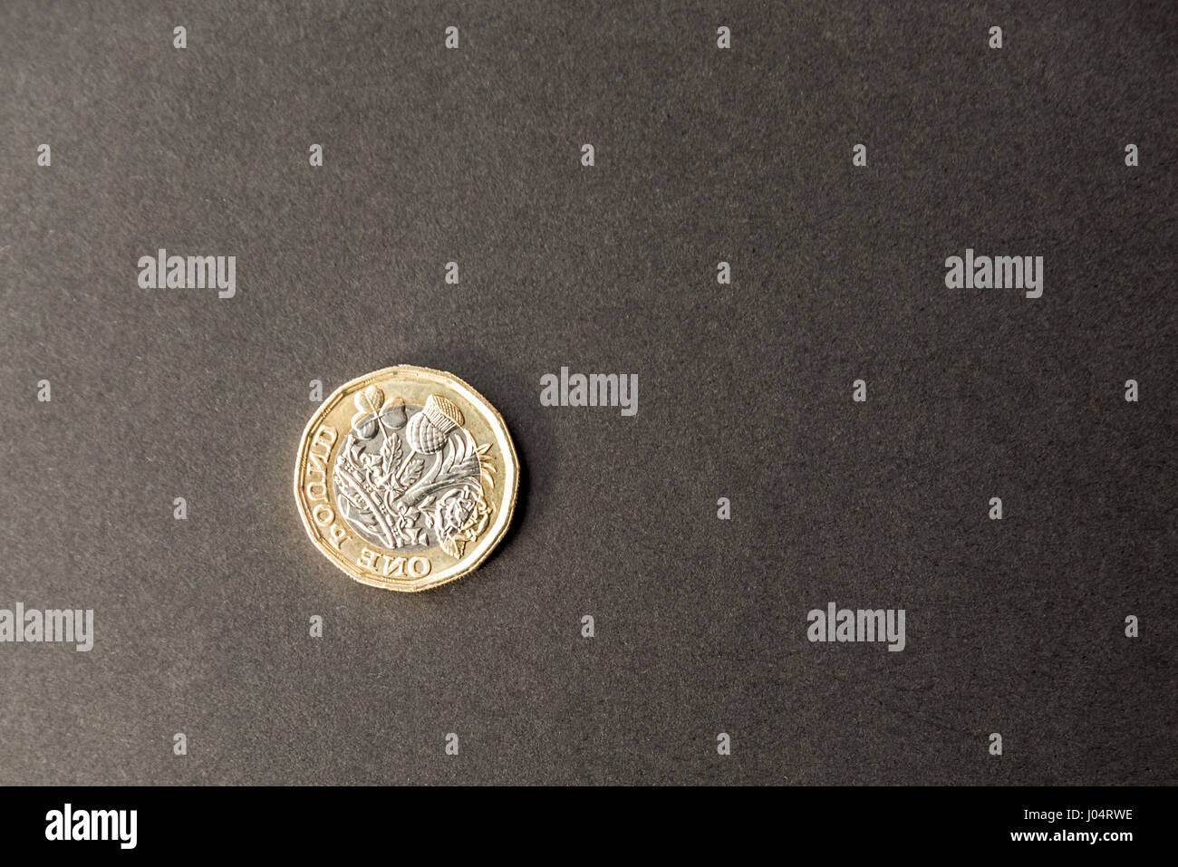 New british one sterling pound coin on dark background Stock Photo - Alamy