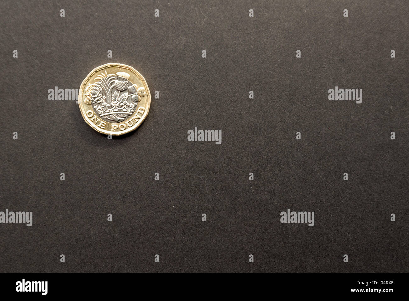 New british one sterling pound coin on dark background Stock Photo - Alamy