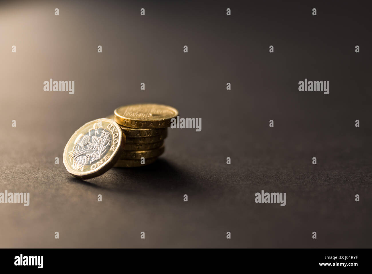 New british one sterling pound coin on dark background Stock Photo - Alamy
