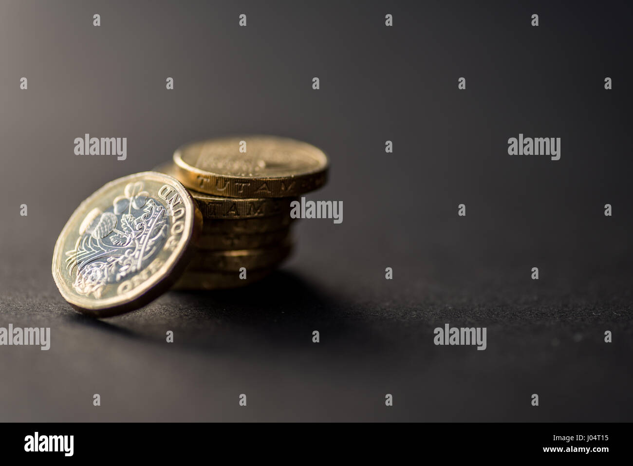 New british one sterling pound coin on dark background Stock Photo - Alamy