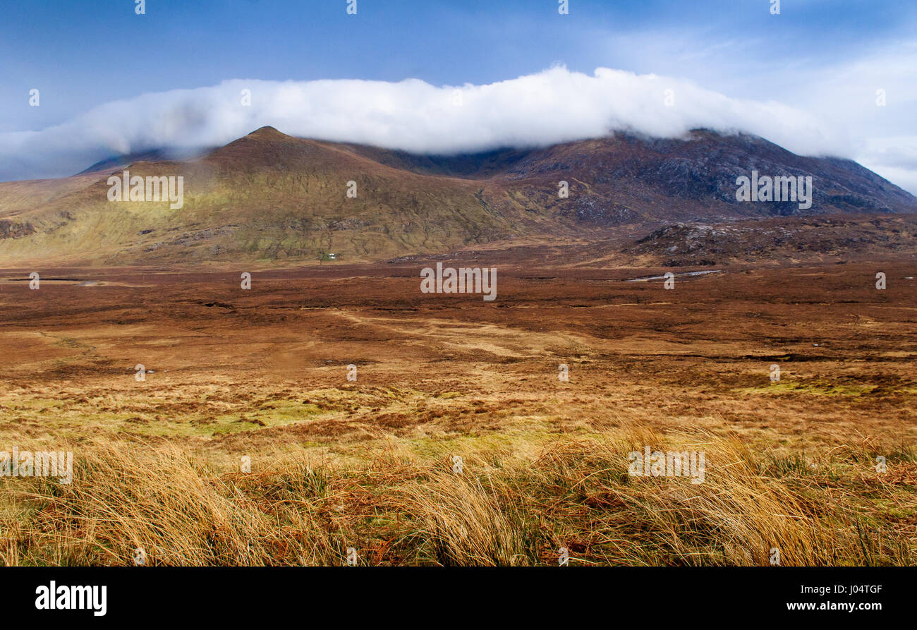Cloud rolls over Beinn Spionnaidh mountain near Durness in the bleak ...