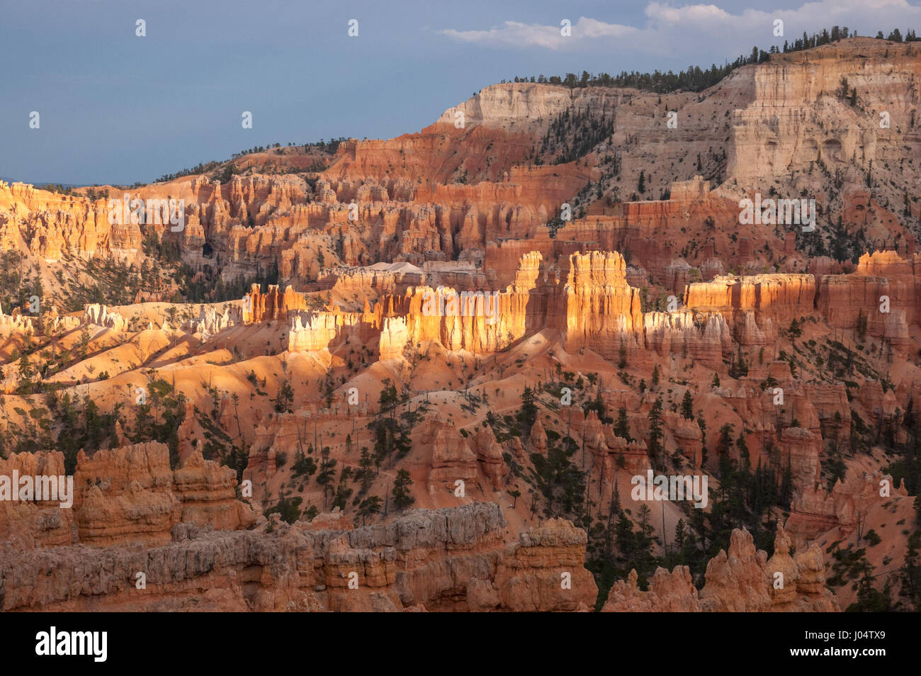 First sun-rays of the day start to illuminate parts of Utah's Bryce ...