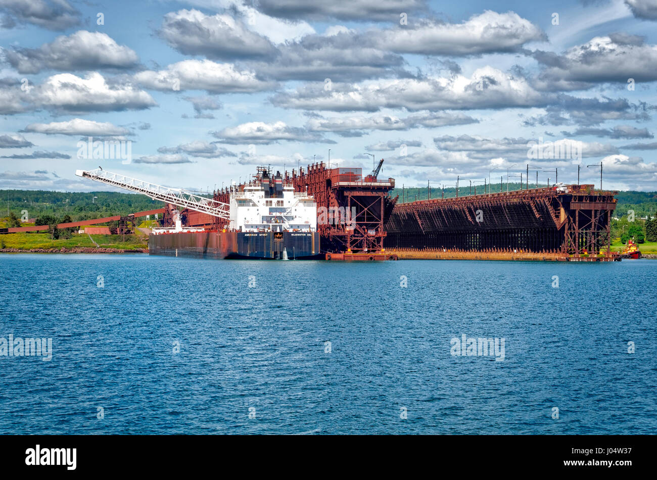 Iron ore (taconite pellets) being loaded from rail cars onto great ...