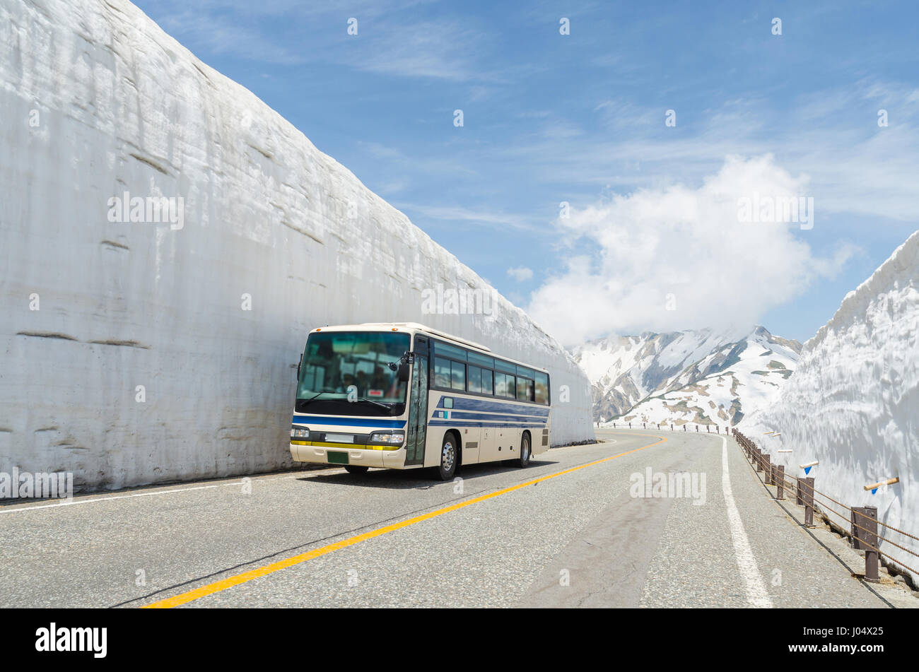 Blur windshield and windows bus move along snow wall at japan alps ...