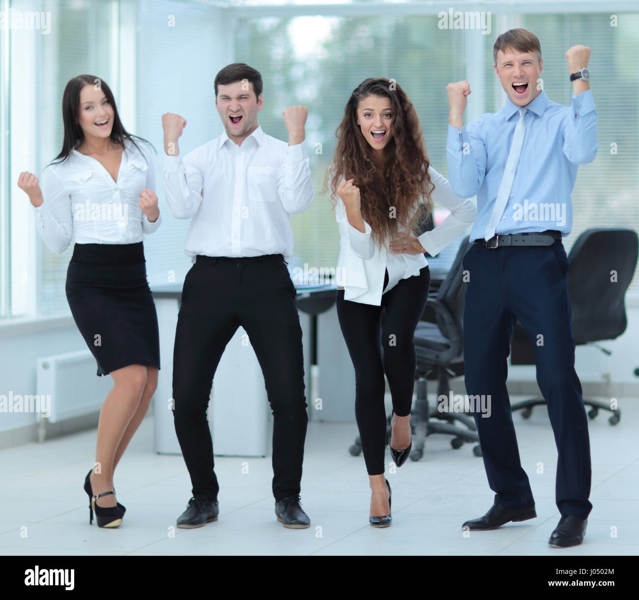 Successful and confident business team celebrating win Stock Photo - Alamy
