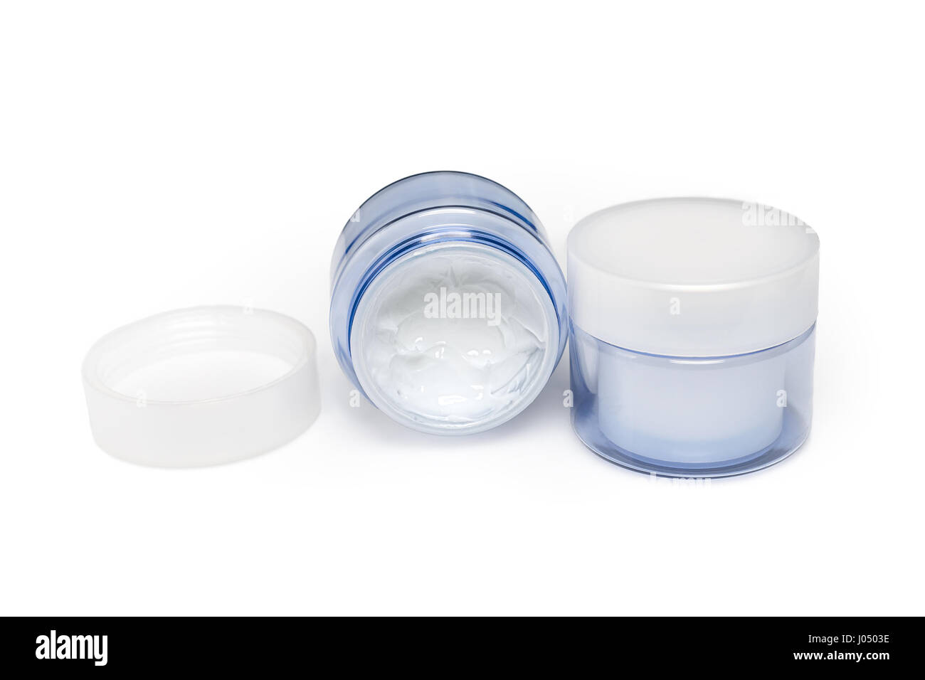 Two containers of moisturizing face cream on white background Stock ...
