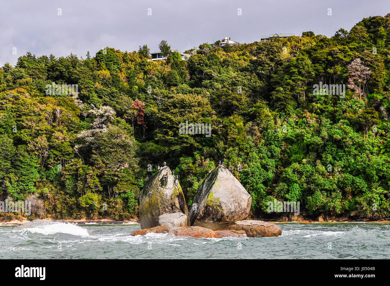 Split apple rock in the Abel Tasman National Park in New Zealand Stock ...