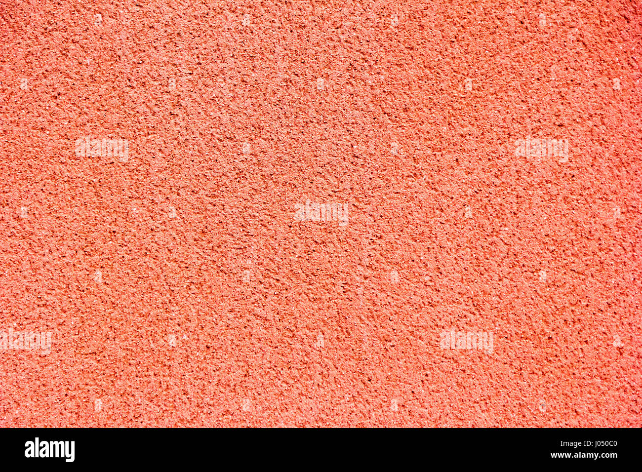 Orange outdoor plaster on a house wall Stock Photo - Alamy
