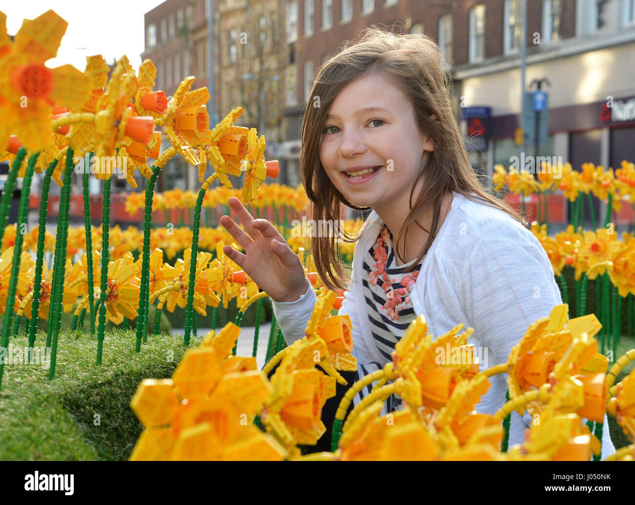 EDITORIAL USE ONLY Poppy Baker, 9, looks at a flowerbed made from 1700 ...