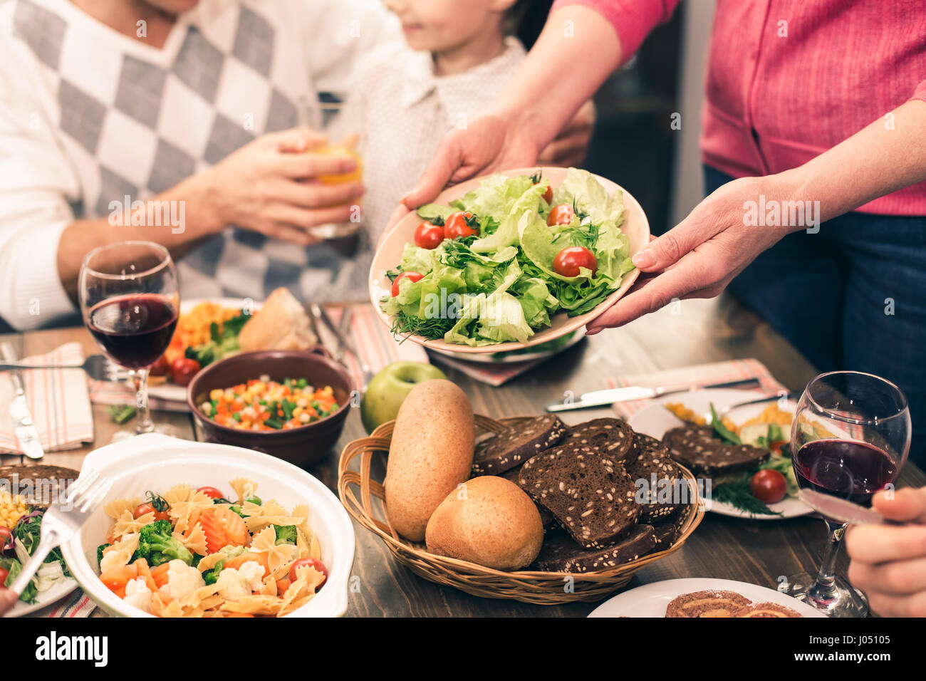 Nice family having tasty dinner Stock Photo - Alamy