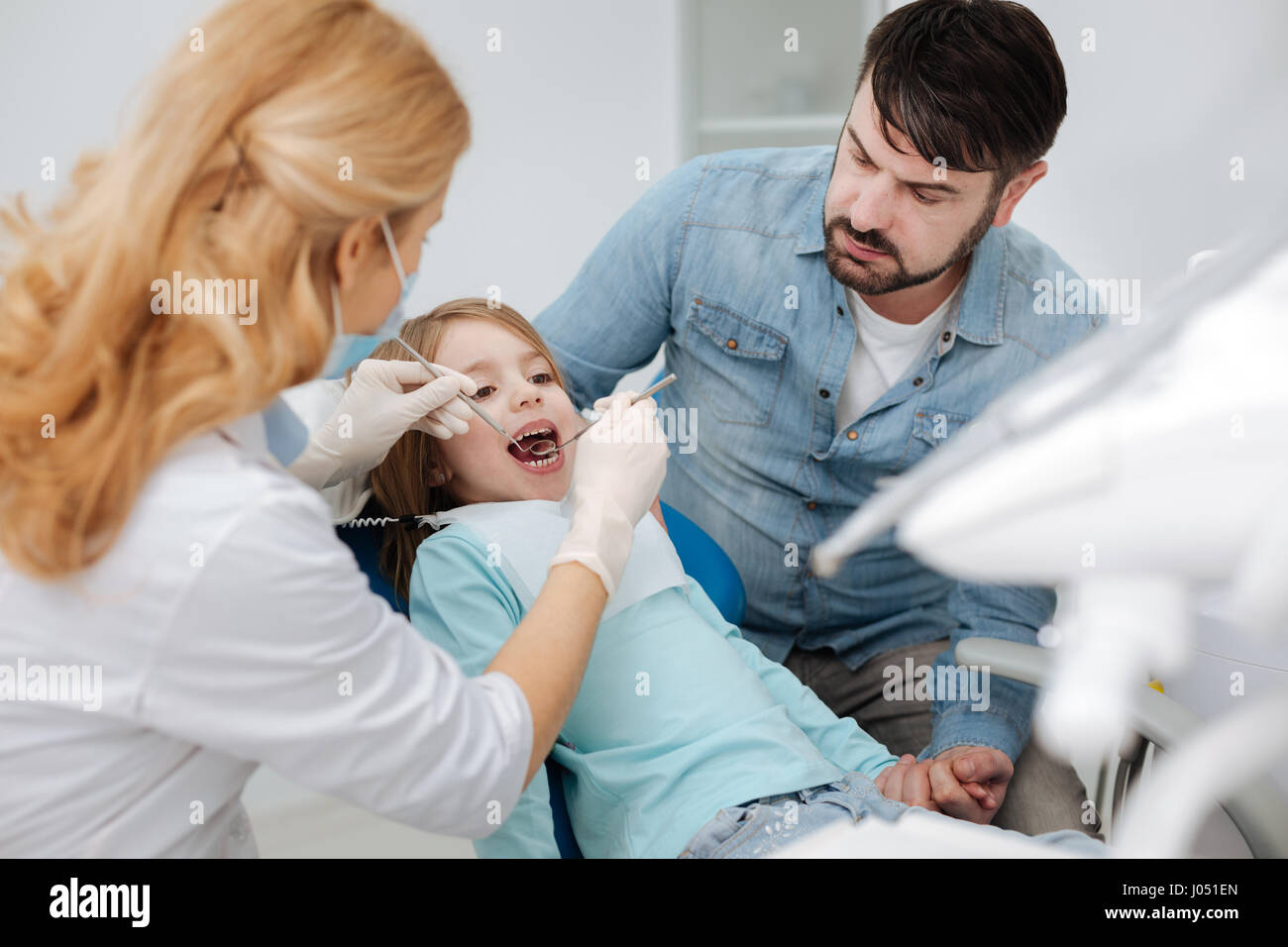 Supportive dad holding his daughters hand Stock Photo - Alamy