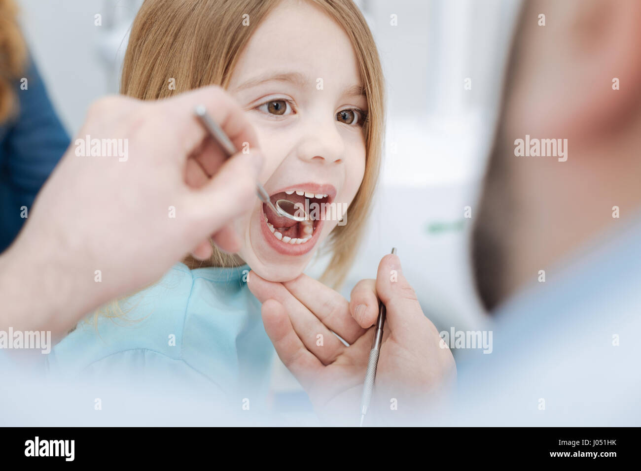 Almost smiling. Emotional orderly admirable girl behaving like a nice ...