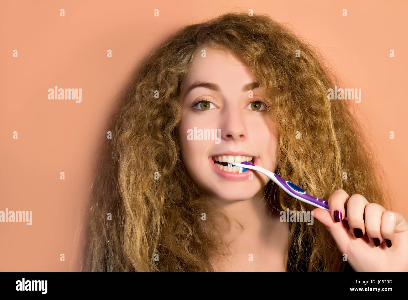 Beautiful smiling brushing hair hi-res stock photography and images - Alamy