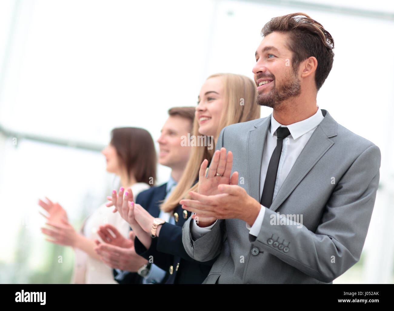 Business people standing in a row looking in same direction and Stock ...