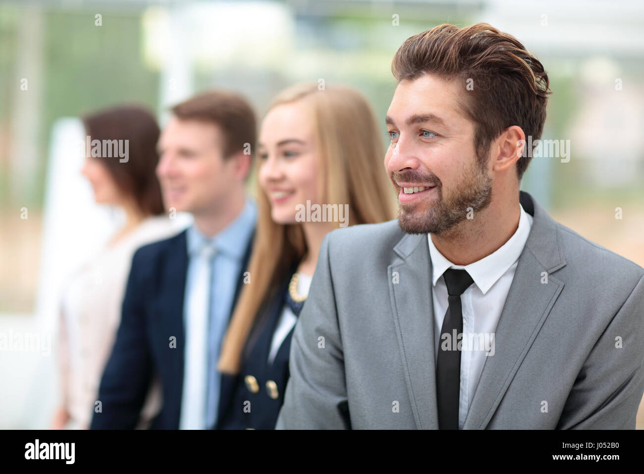 Business people standing in a row looking in same direction Stock Photo ...