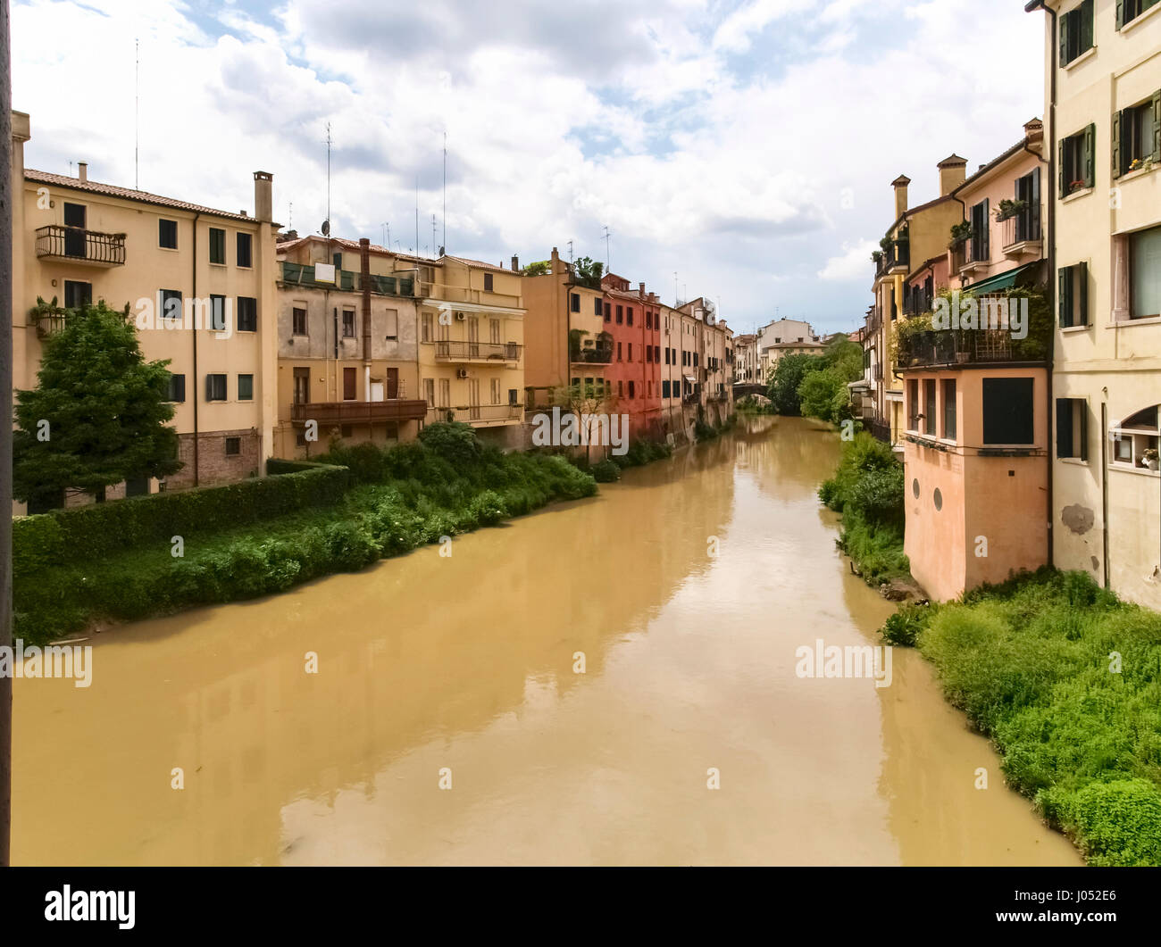 Padova, Italy - May 16, 2016: Channel navigable river with houses on ...