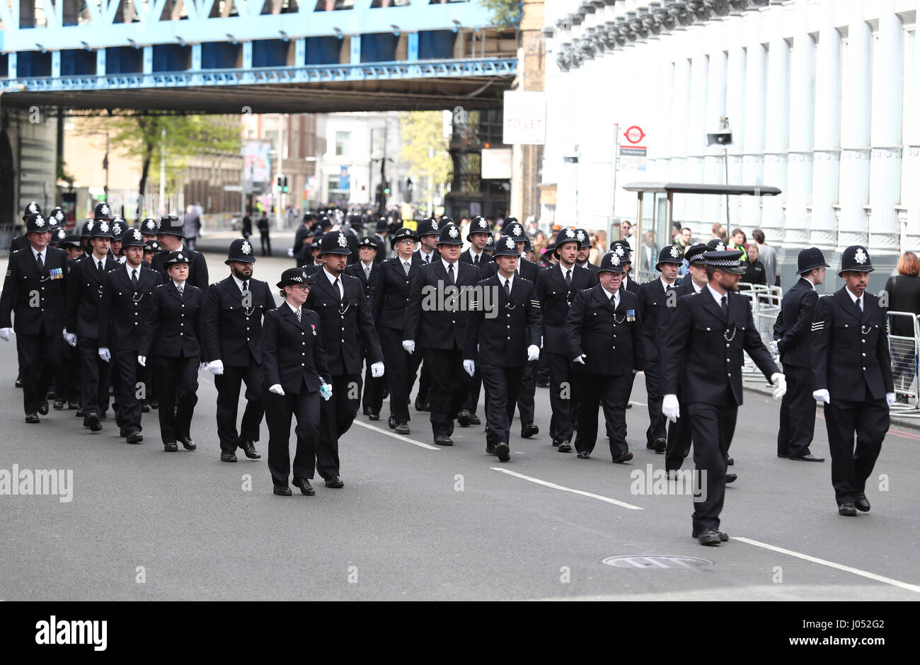 Police officers make their way to Southwark Cathedral in London, before ...