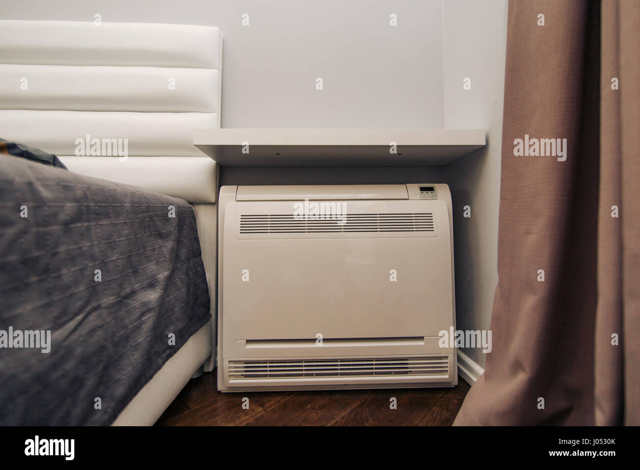 Square air conditioner in the apartment. On the floor, split system ...